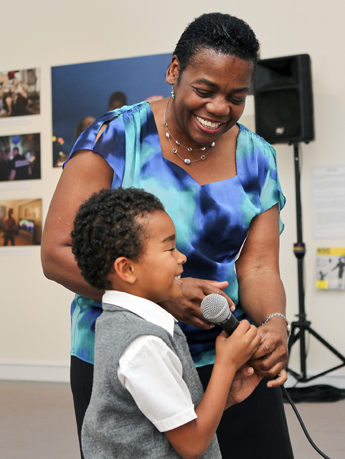 helping a young student at a speaking engagement in 2013